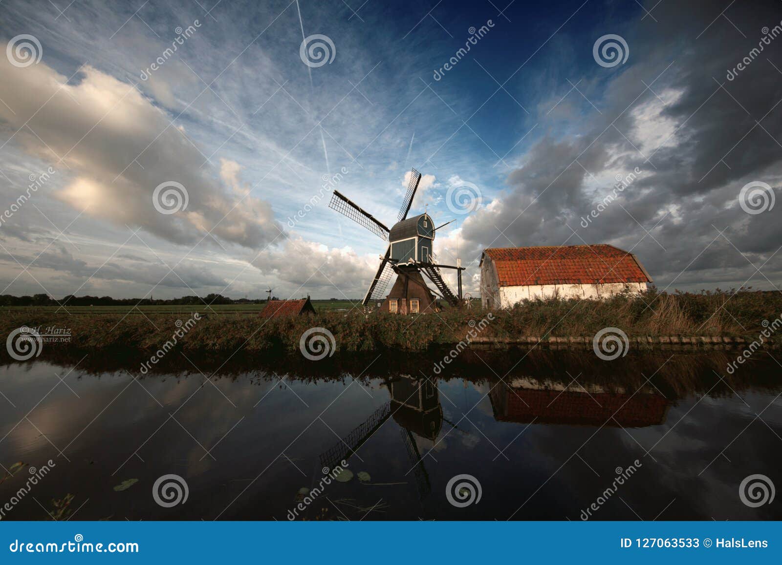 WIndmill and Barn stock image. Image of field, burning - 127063533