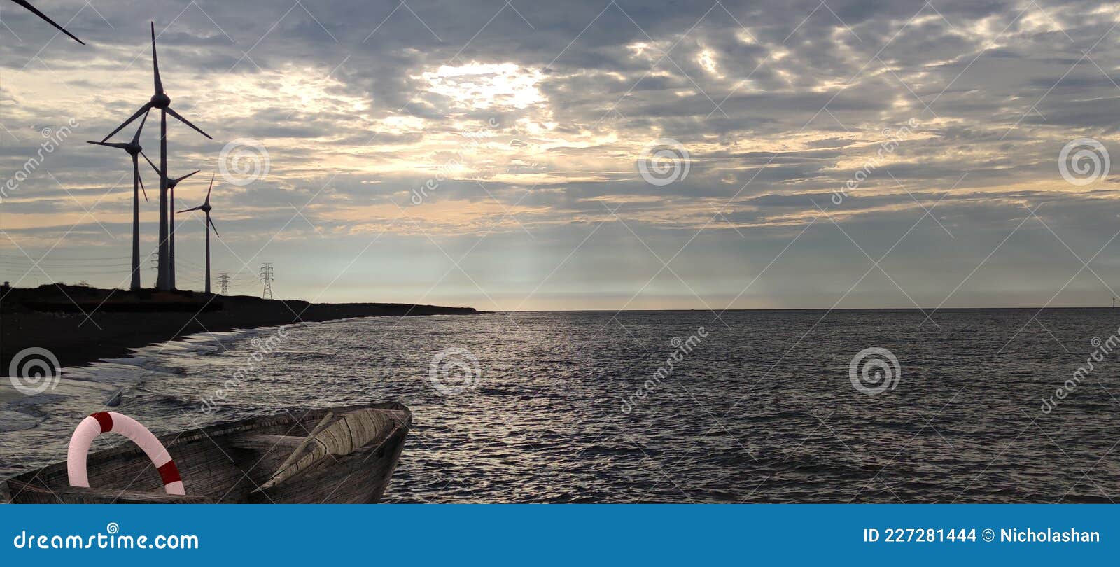 Windmill on the Beach and Traditional Wood Made Boat Stock Photo ...