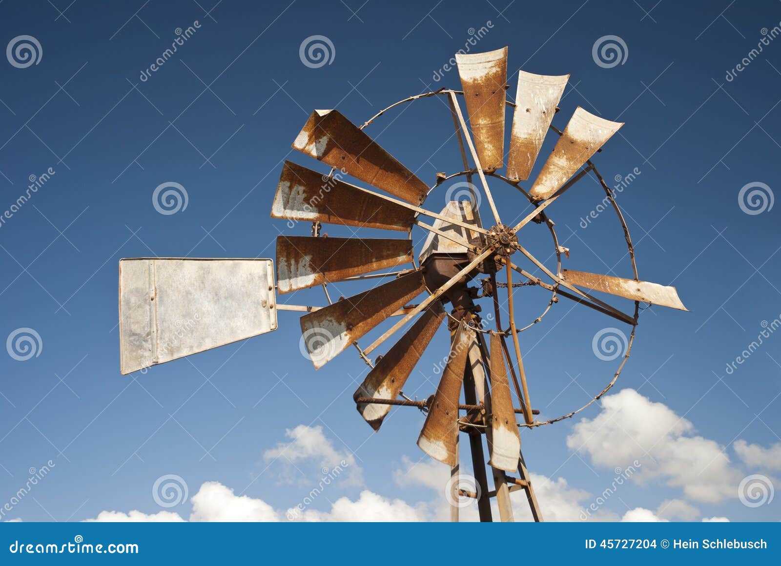 Windmill with Blue Skies Overhead Stock Photo - Image of cactus ...