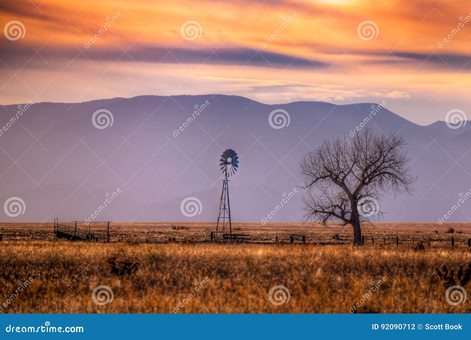Windmill on the Colorado Plains Stock Photo - Image of sunset, water ...