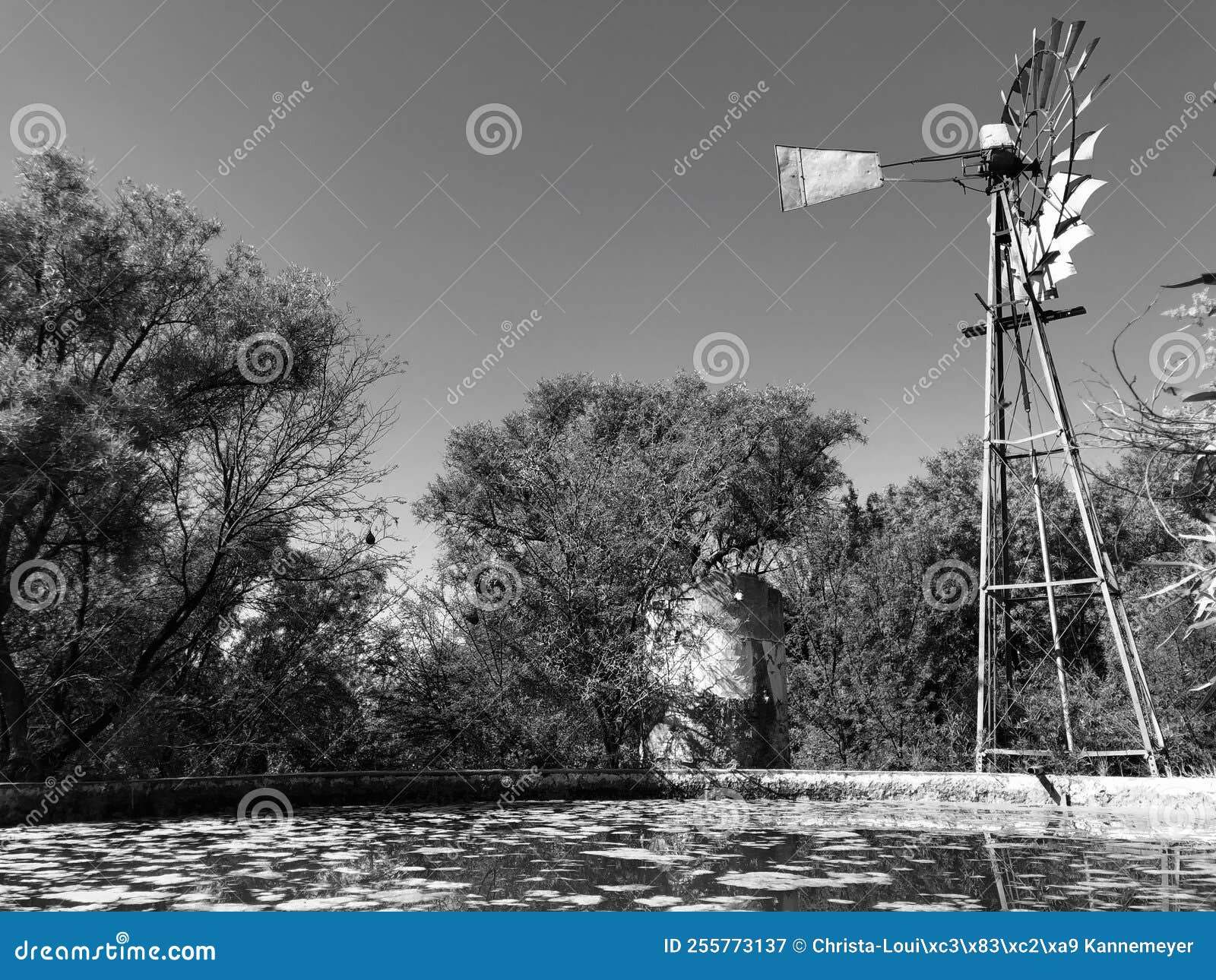 The windmill and the dam stock image. Image of wind - 255773137