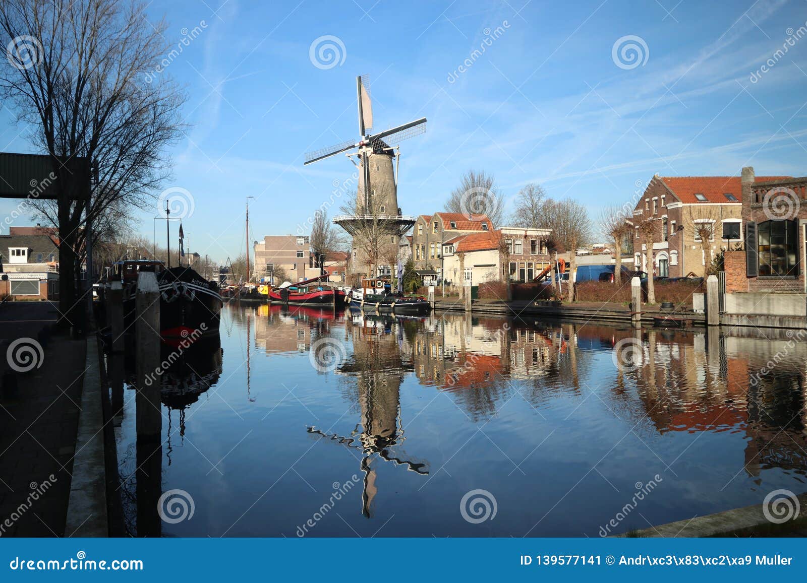 Windmill De Roode Leeuw with Reflection in the Turfsingel in Gouda with ...