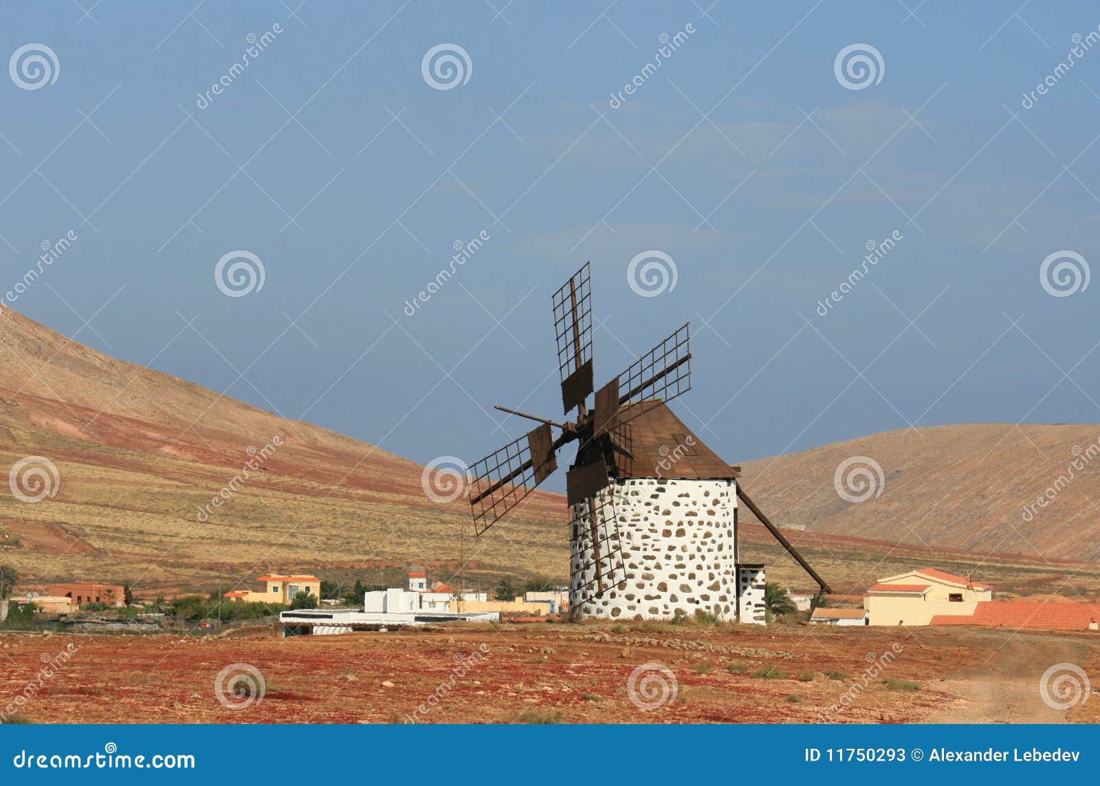 Windmill in the desert stock image. Image of canary, traditional - 11750293