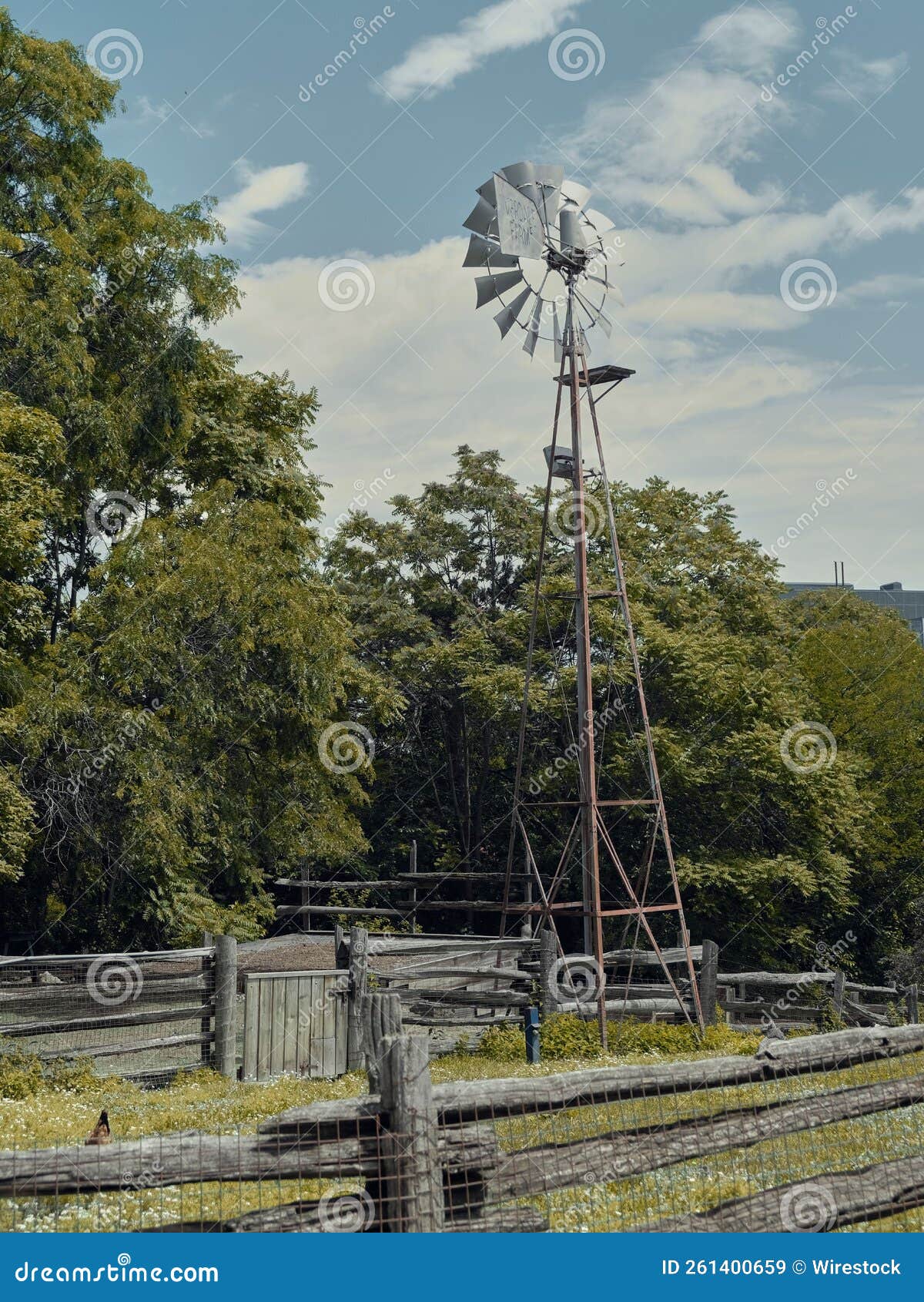 Ancient windmill in a farm stock image. Image of green - 261400659