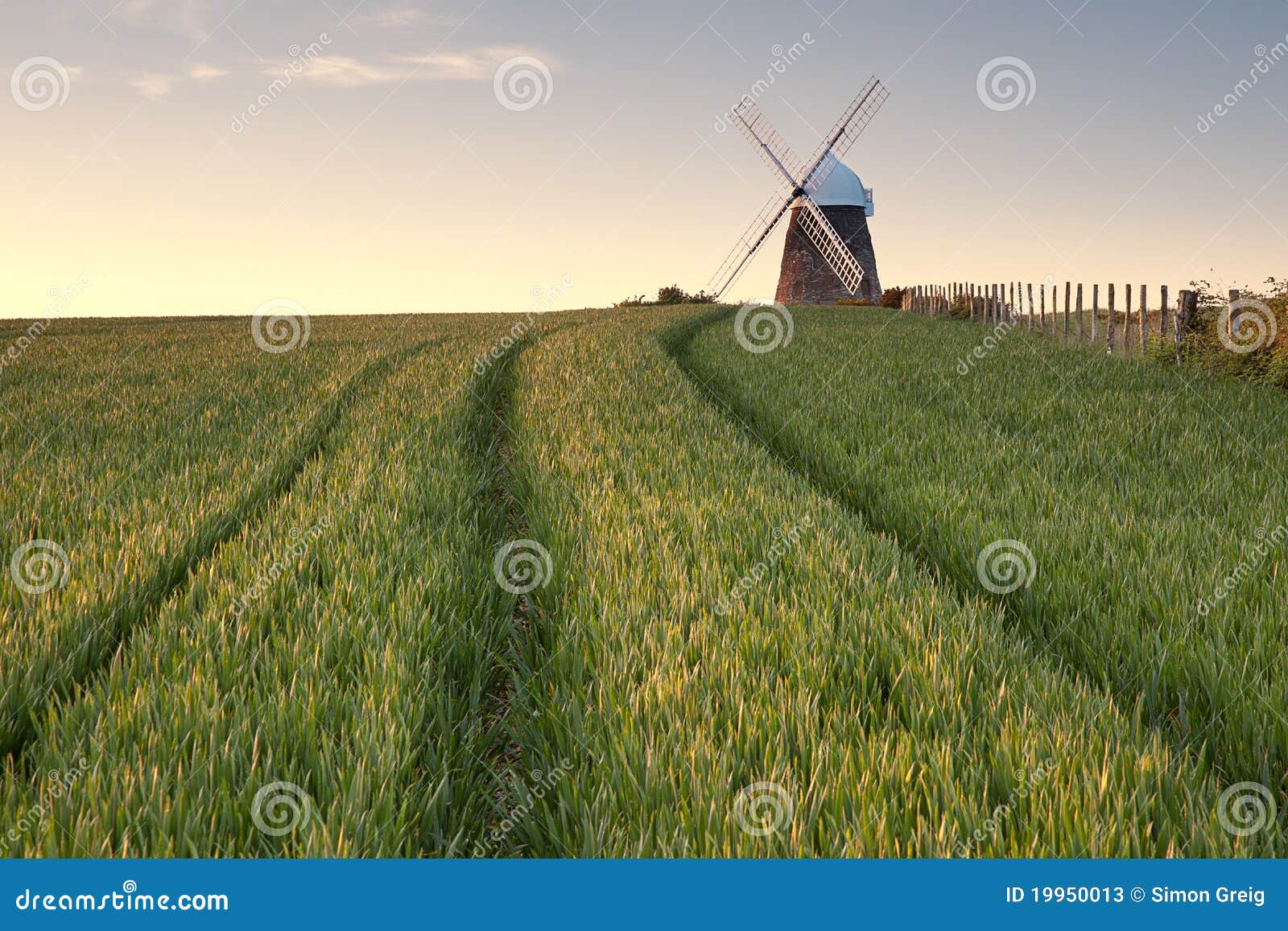 Windmill in a Field stock image. Image of industrial - 19950013