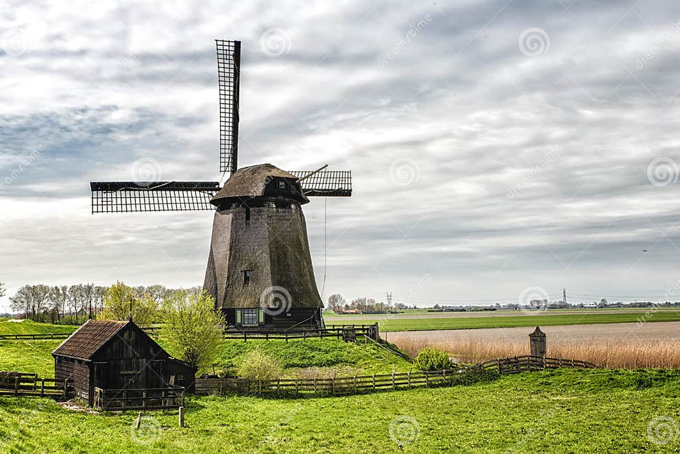 Windmill in a field stock photo. Image of meadow, fuel - 72383166