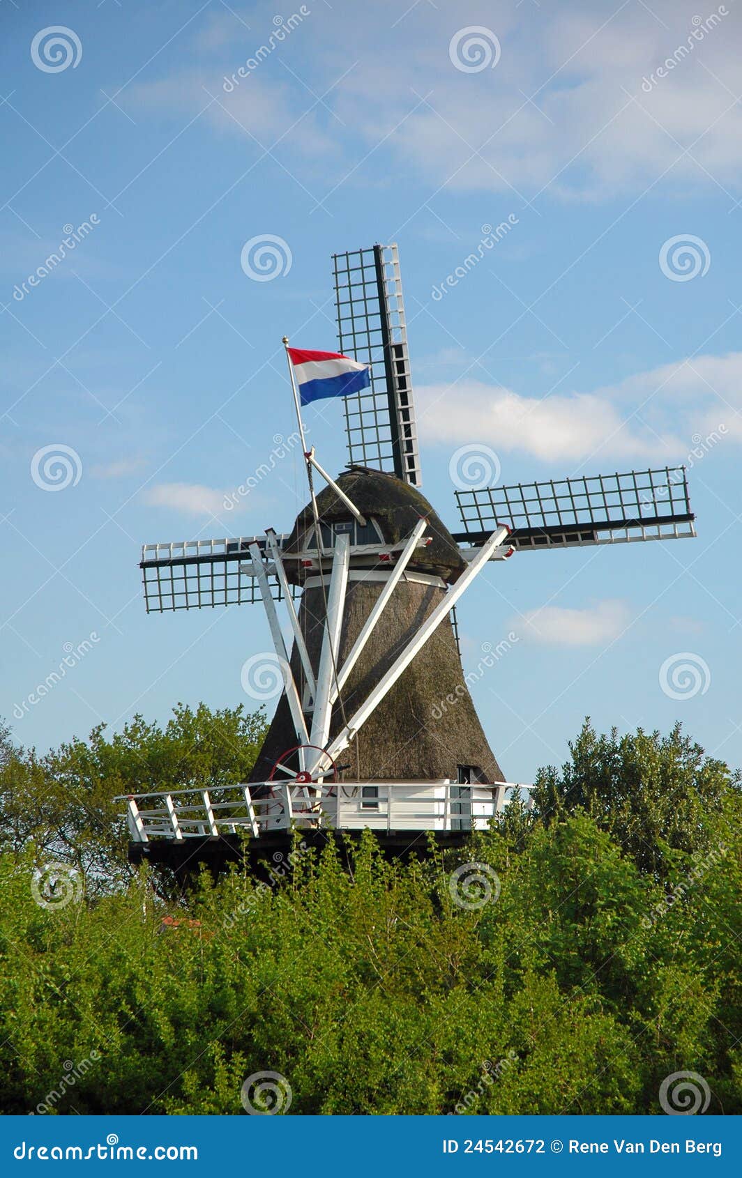 Windmill with flag stock photo. Image of historical, cloud - 24542672