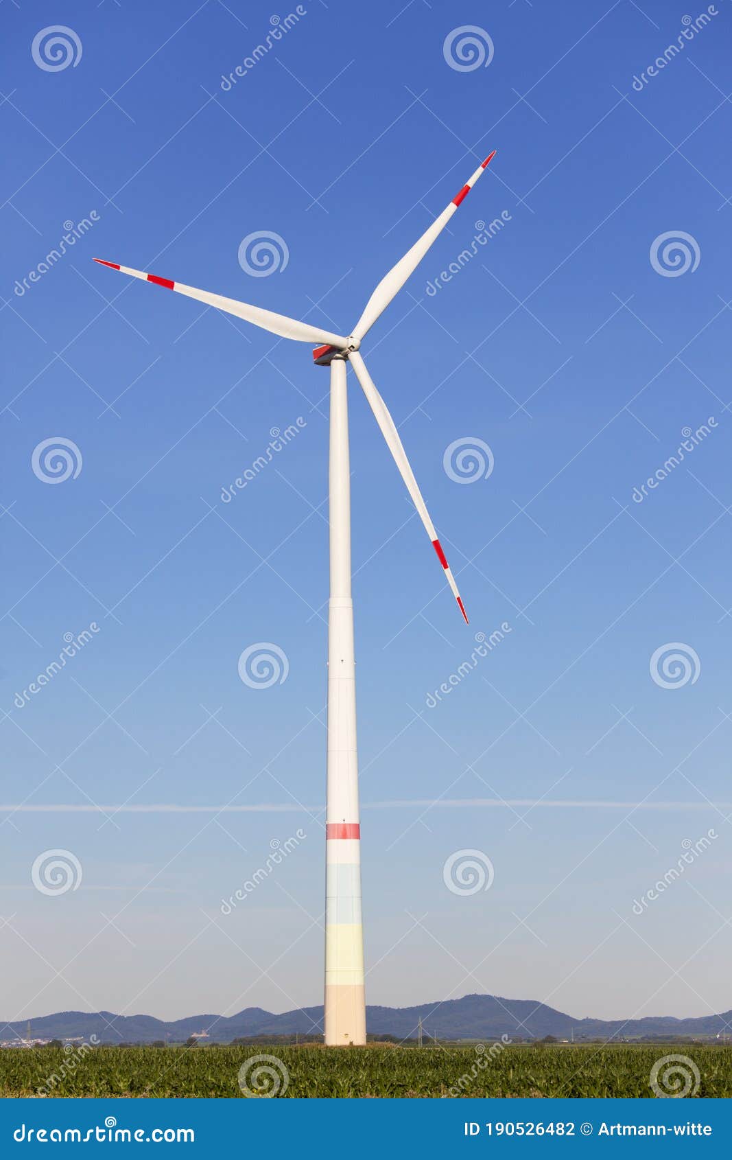 Windmill in Front of a Landscape with Hills Producing Green Electricity ...