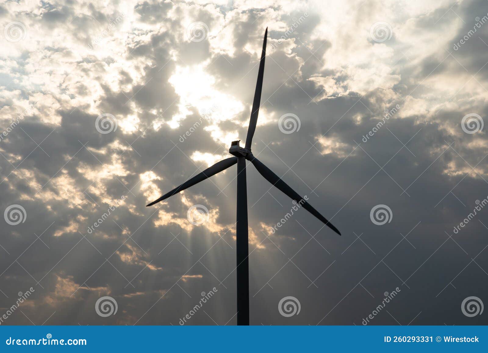 Windmill Generator in the Background of the Cloudy Sky and Rays of ...