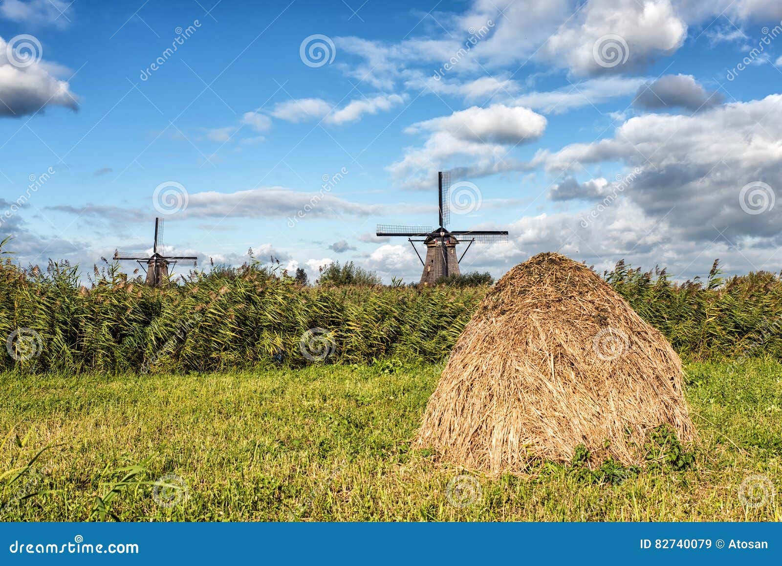Windmill and Haystacks stock image. Image of scene, historical - 82740079