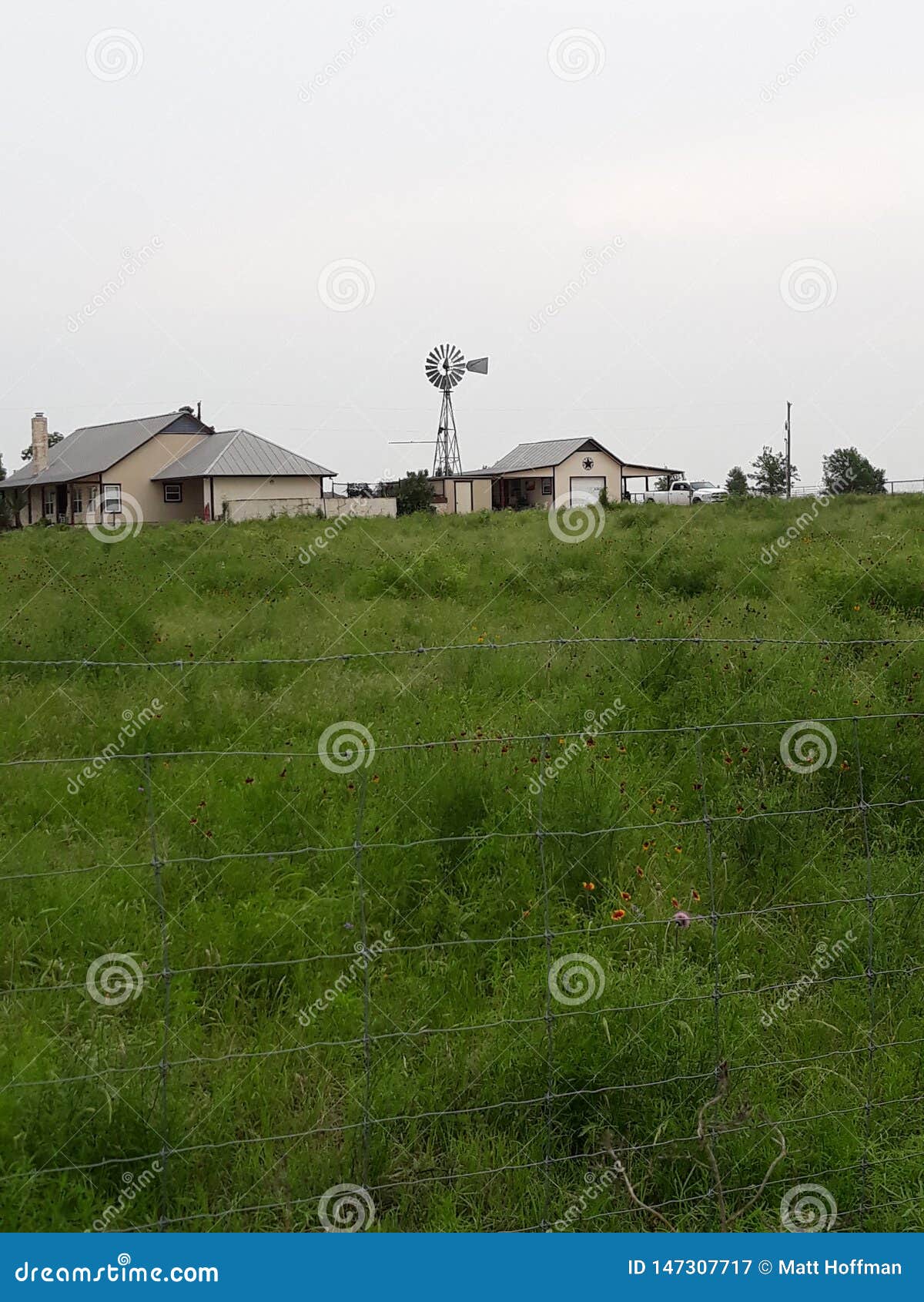 Windmill Highlights Ranch Home Stock Image - Image of windmill, ranch ...