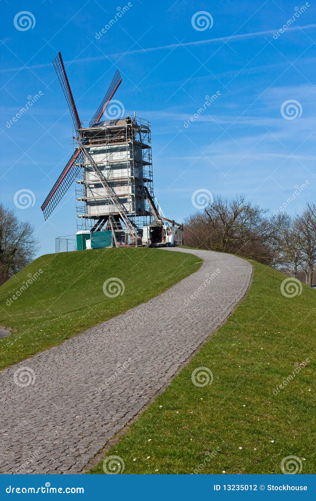 Windmill on hill with path stock photo. Image of idyllic - 13235012
