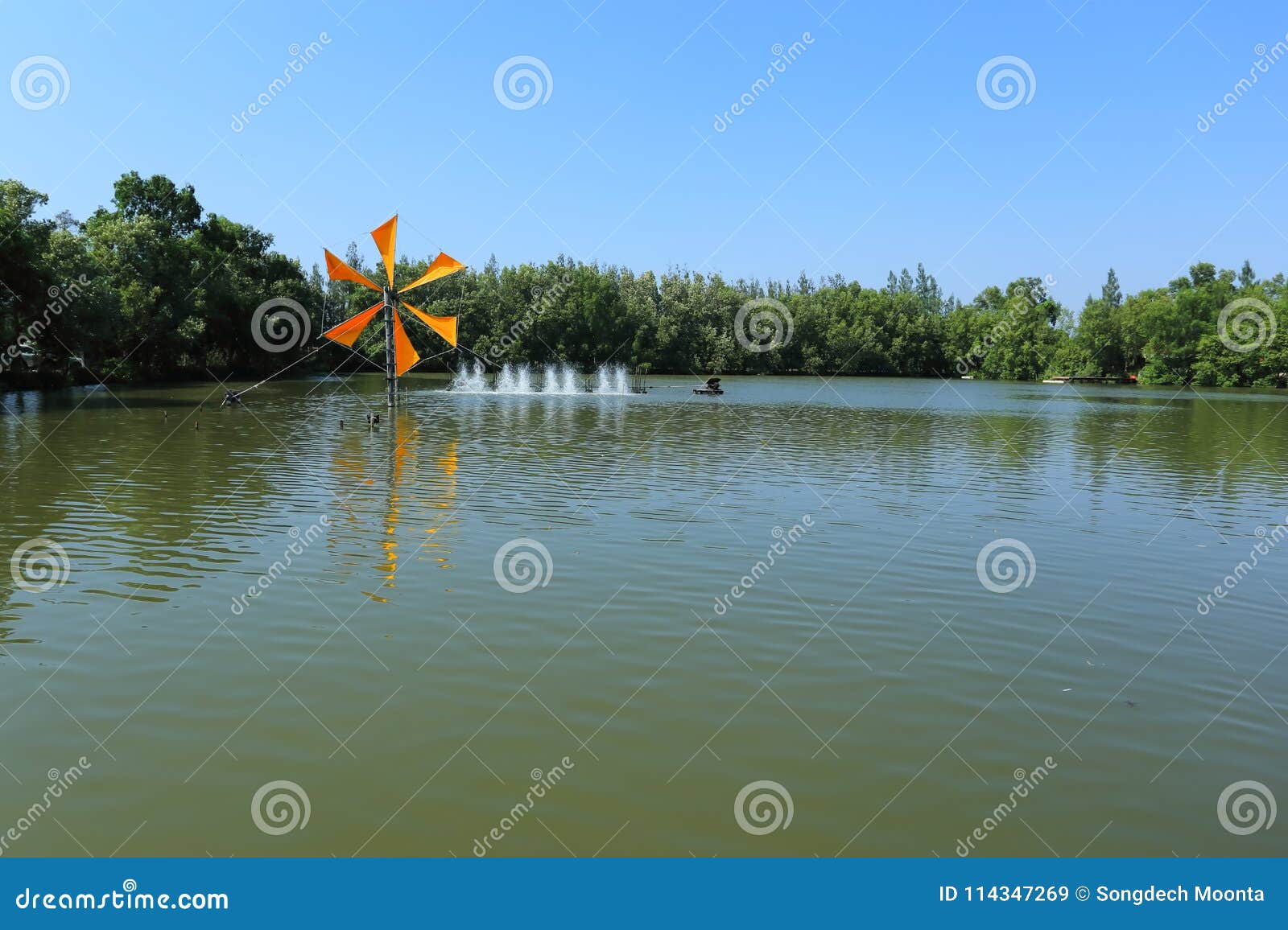 Windmill and lake stock image. Image of aeration, pond - 114347269
