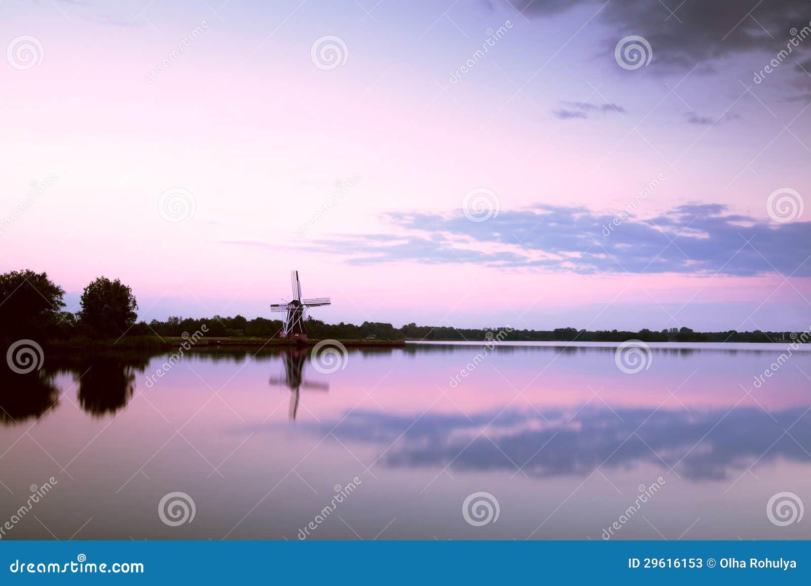 Windmill Reflection in Big Lake Stock Image - Image of dramatic ...