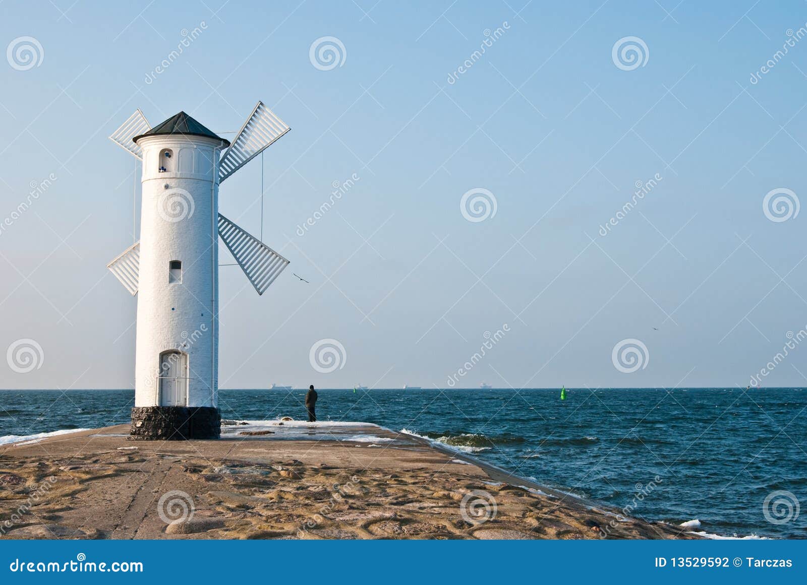 Windmill on the seashore stock photo. Image of shore - 13529592