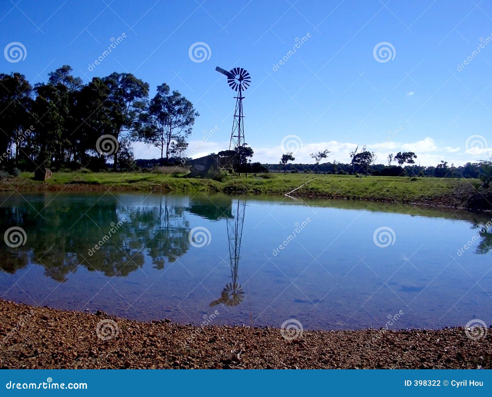 Windmill, shed and pond stock photo. Image of pump, water - 398322