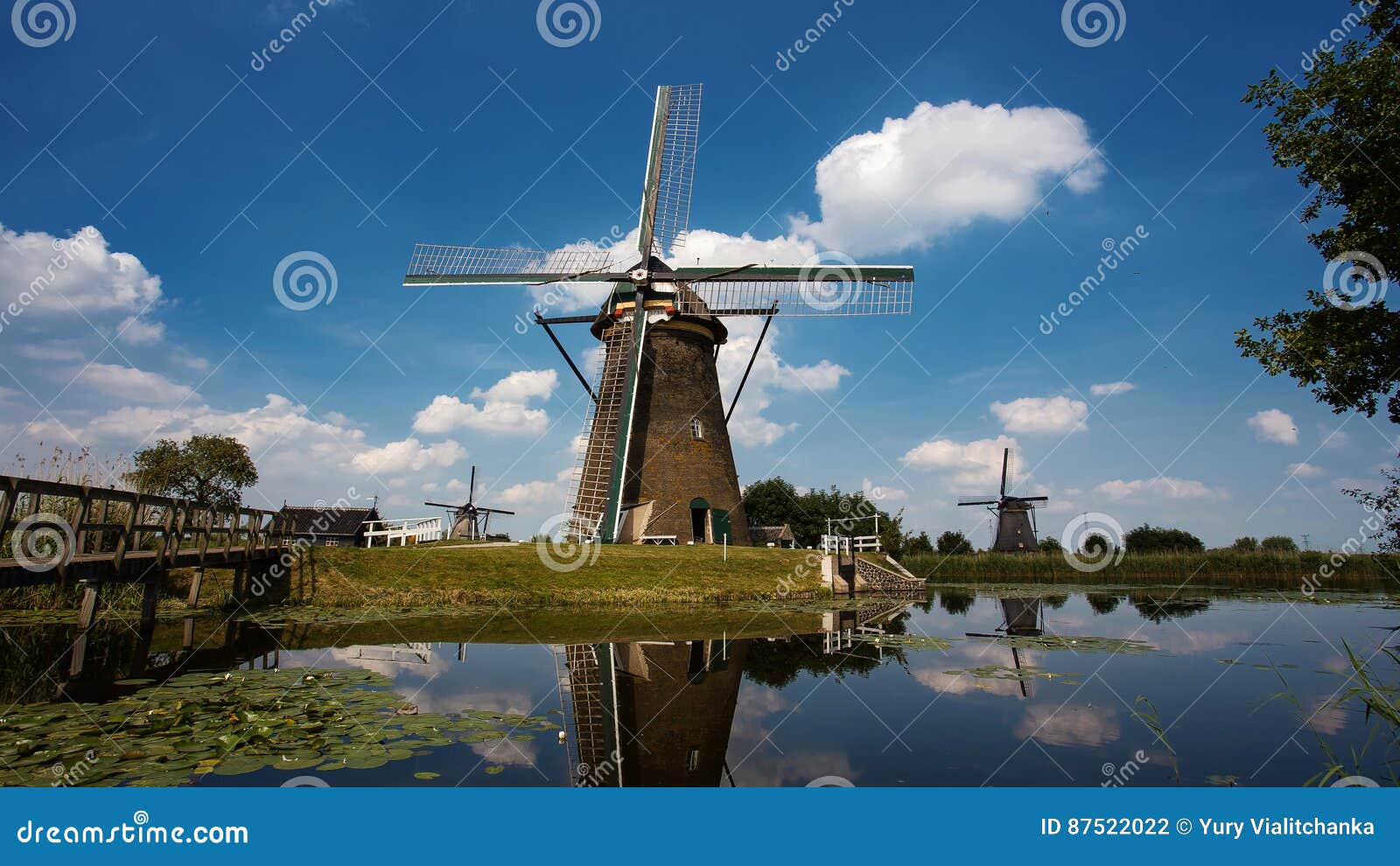 Windmill on the Shore of the Lake Stock Photo - Image of lake, field ...