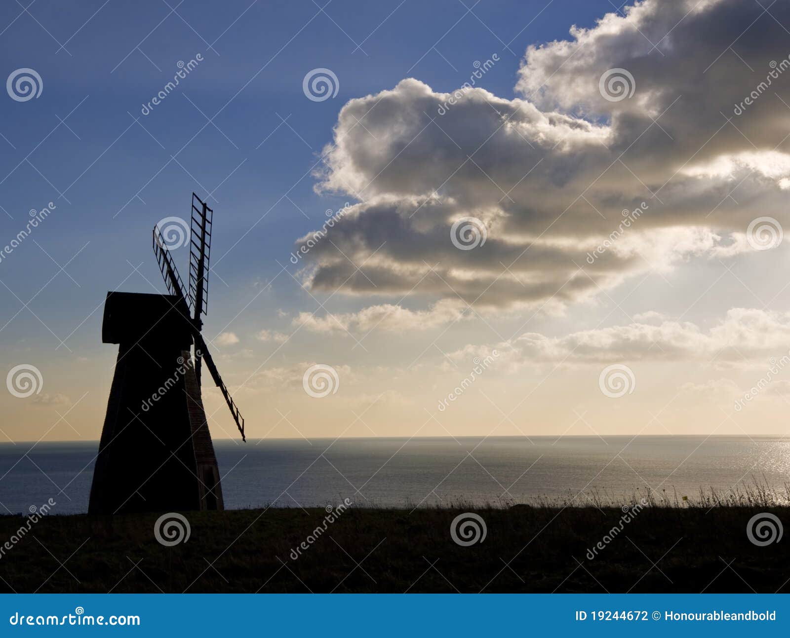 Windmill Silhouette Blowing Away Dark Clouds Stock Photo - Image of ...