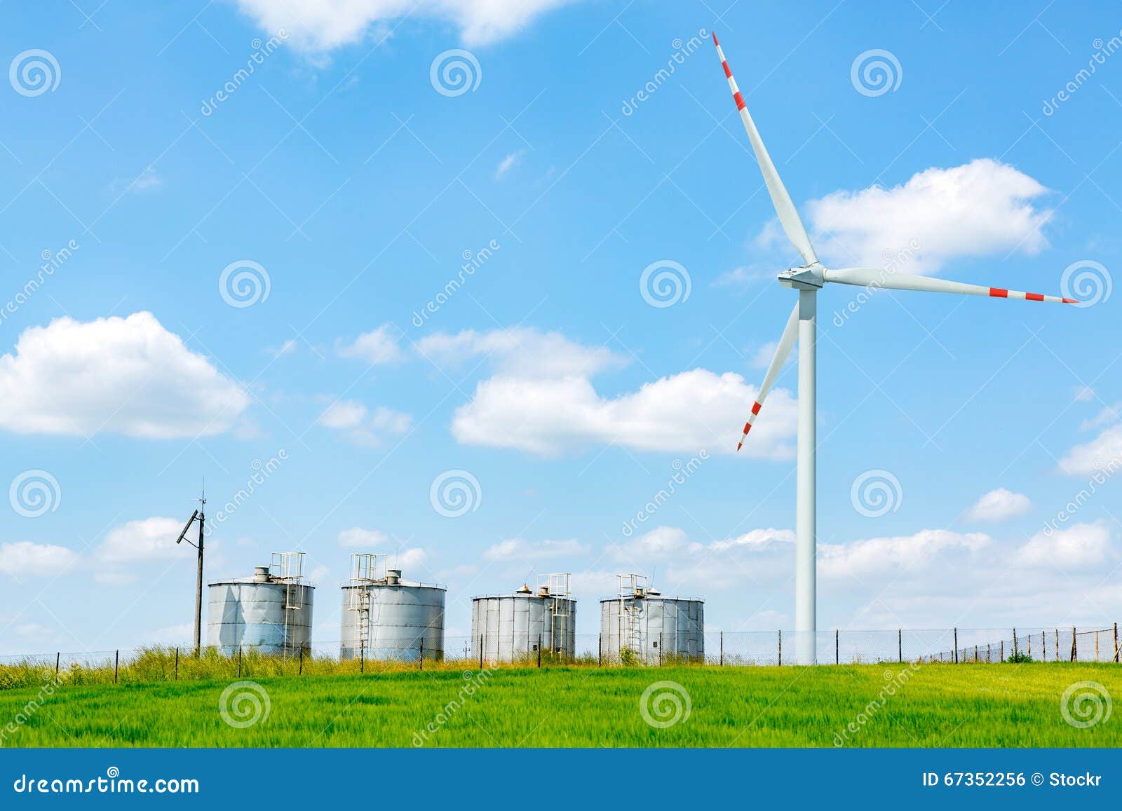 Windmill on the Silos on the Field Stock Photo - Image of container ...