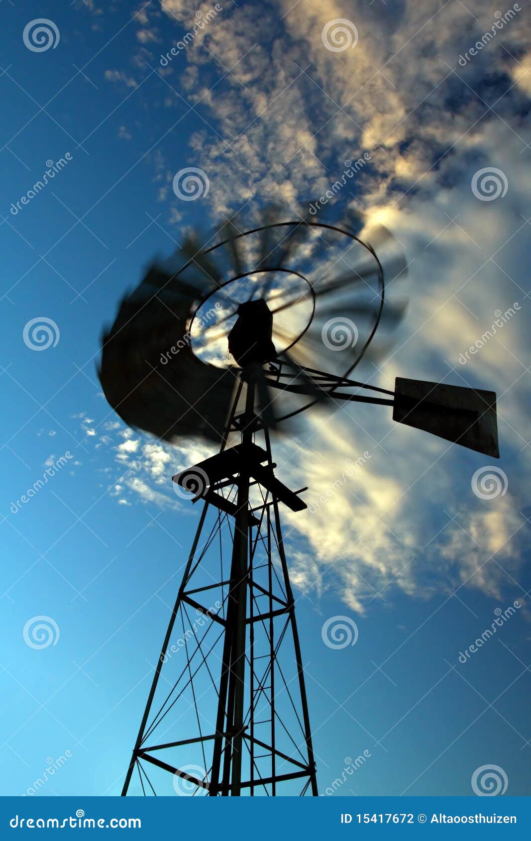 Windmill Spinning Fast at Sunset Stock Photo - Image of rural, movement ...