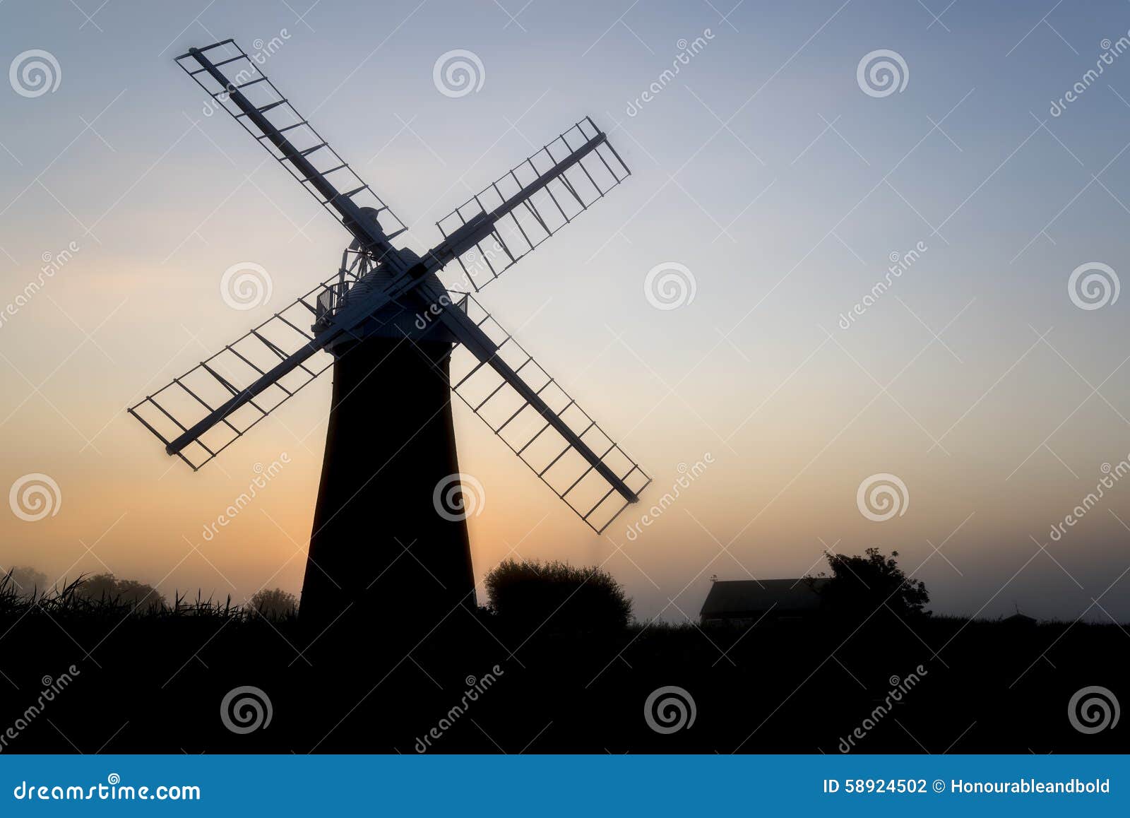 Windmill in Stunning Landscape on Beautiful Summer Dawn Stock Photo ...