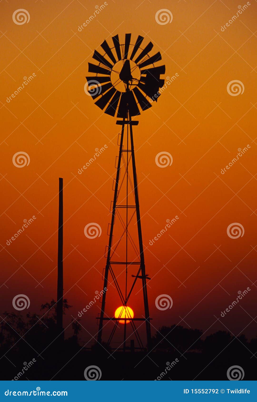 Windmill in the Sunset stock photo. Image of orange, water - 15552792