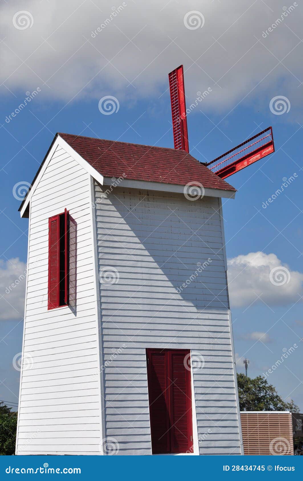 Windmill Tower with Red Sails, Shutters and Door Stock Image - Image of ...