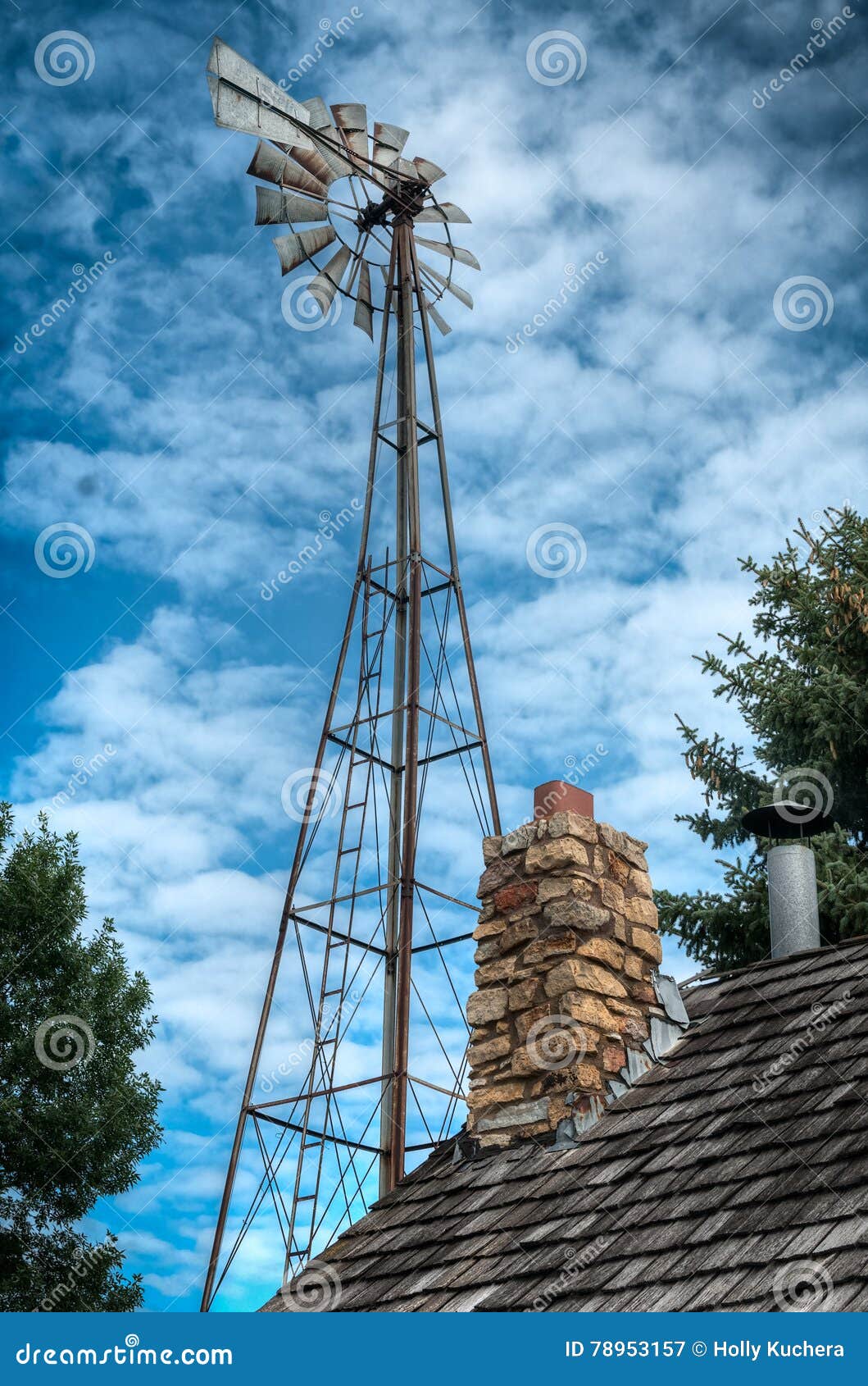 Windmill Towers Over Building Stock Image - Image of windmill, power ...
