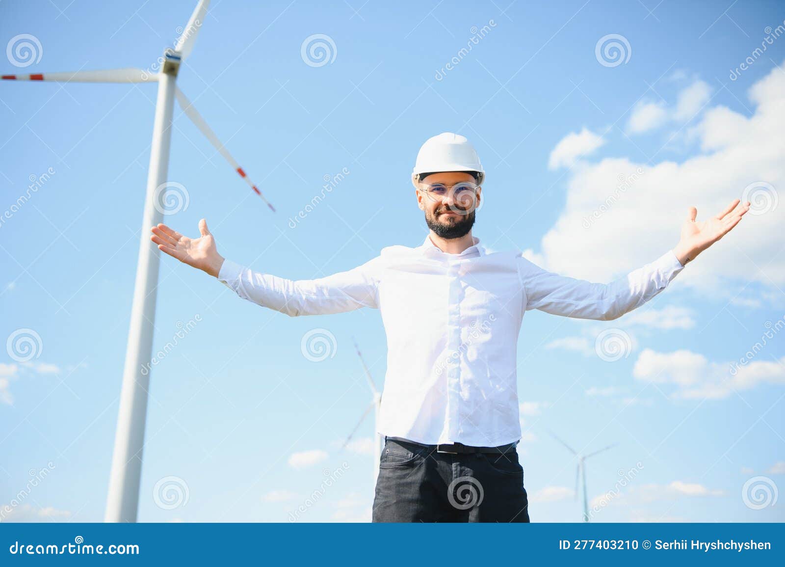 Windmill Turbine Maintenance Engineer Standing at Wind Farm. Stock ...
