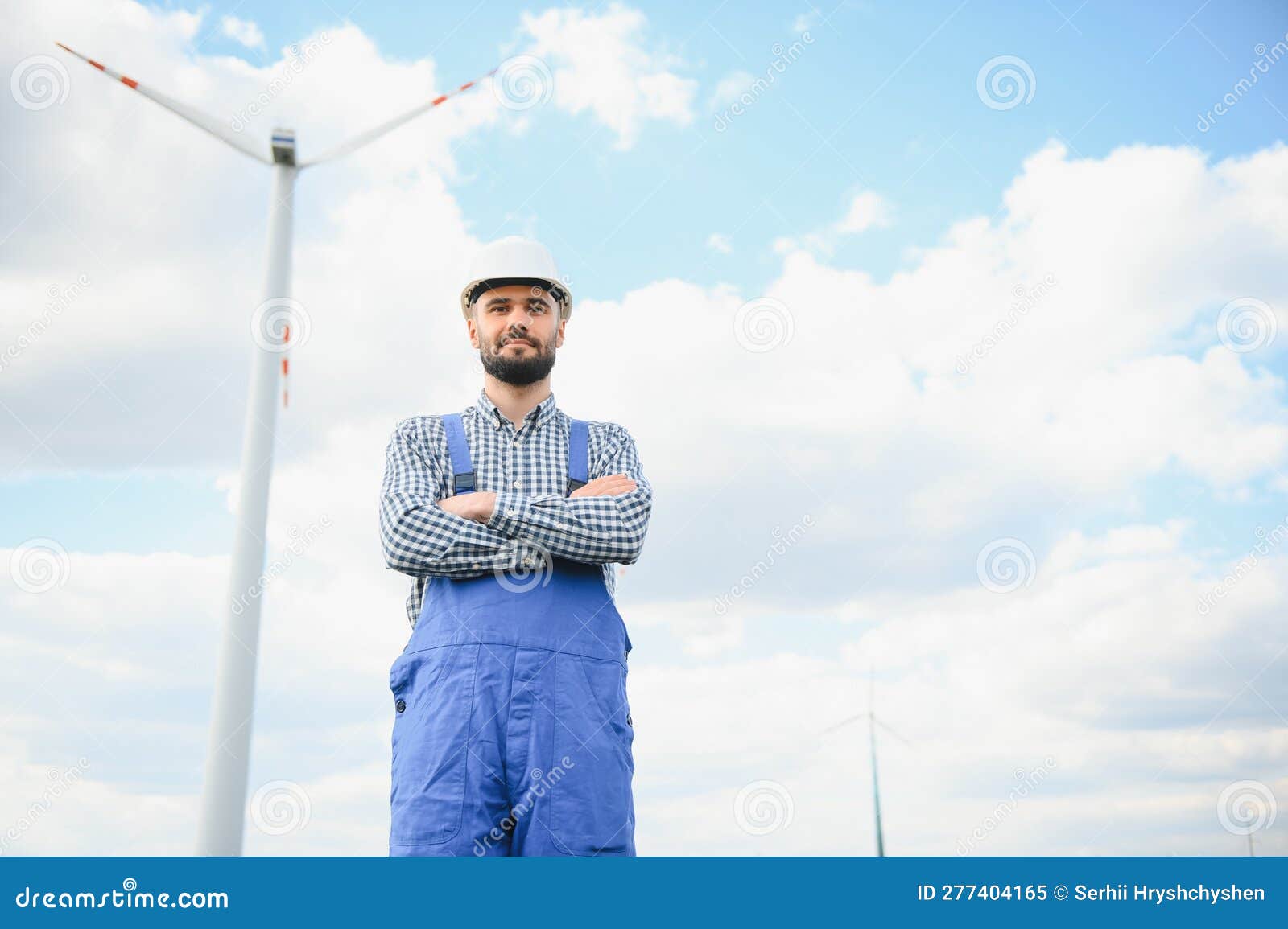 Windmill Turbine Maintenance Engineer Standing at Wind Farm. Stock ...