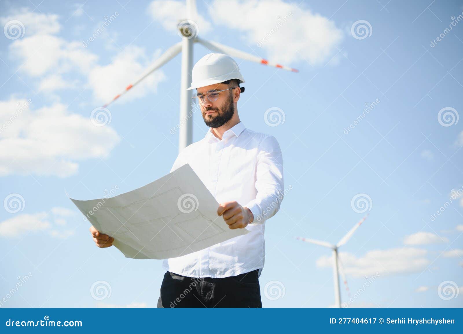 Windmill Turbine Maintenance Engineer Standing at Wind Farm. Stock ...