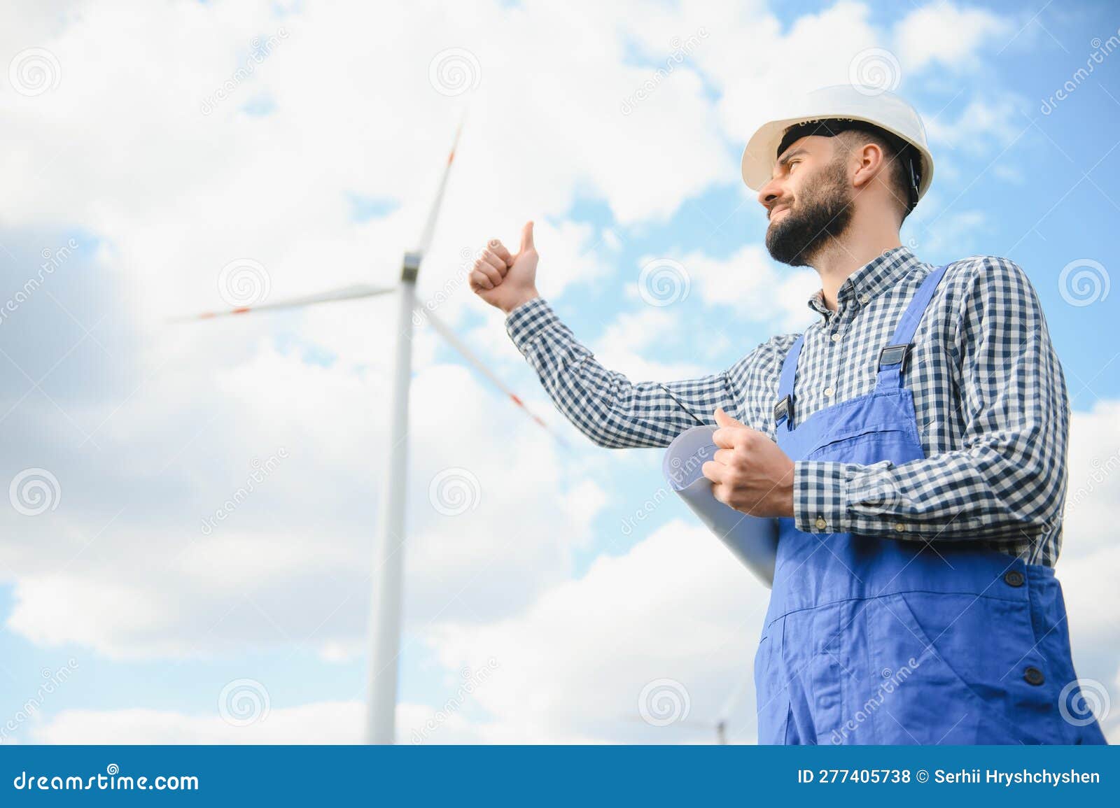 Windmill Turbine Maintenance Engineer Standing at Wind Farm. Stock ...