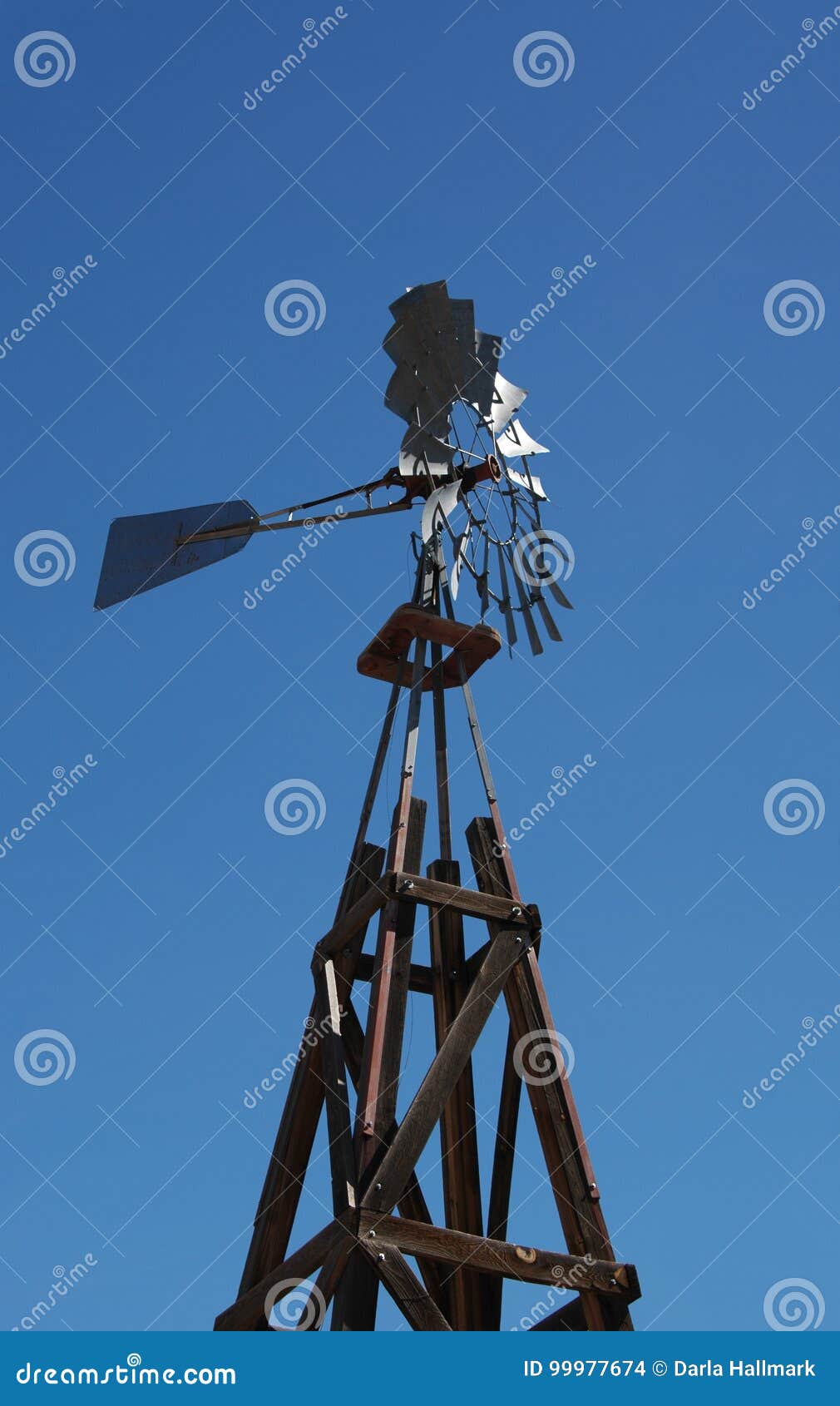 Rustic American Style Windmill Stock Photo - Image of daytime, blue ...