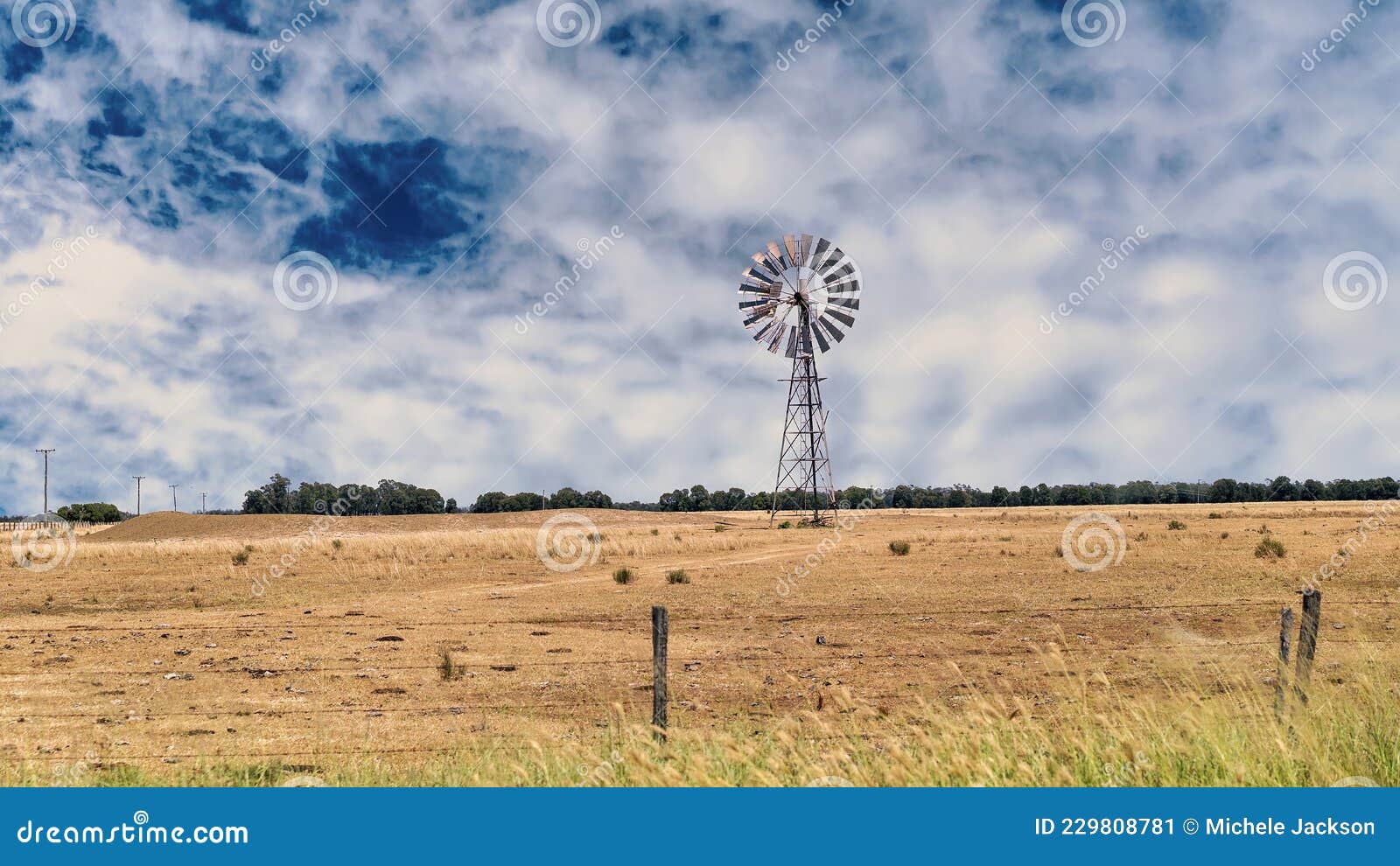 Windmill in Vast Open Outback Space Stock Image - Image of middle ...
