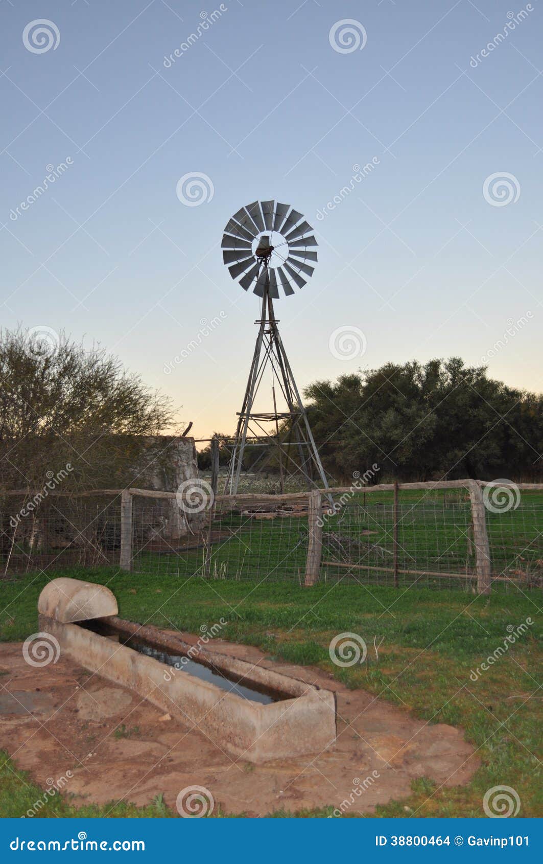 Windmill and Water Trough at Dusk Stock Photo - Image of australia ...