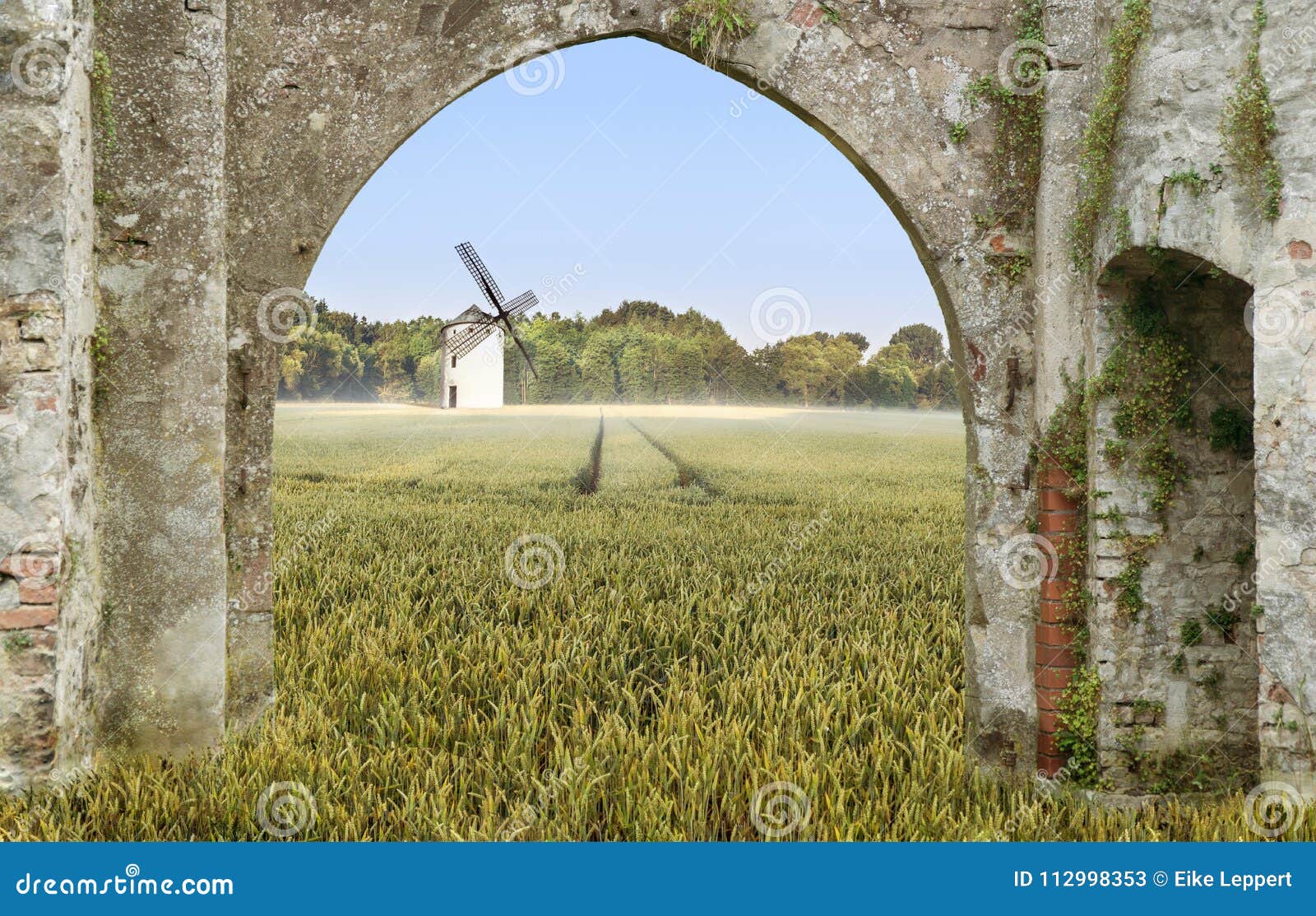 Windmill in a Wheat Field through a Archway. Stock Image - Image of ...