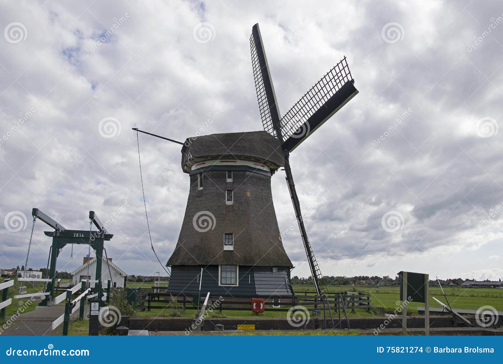 Windmill and wooden bridge stock photo. Image of energy - 75821274
