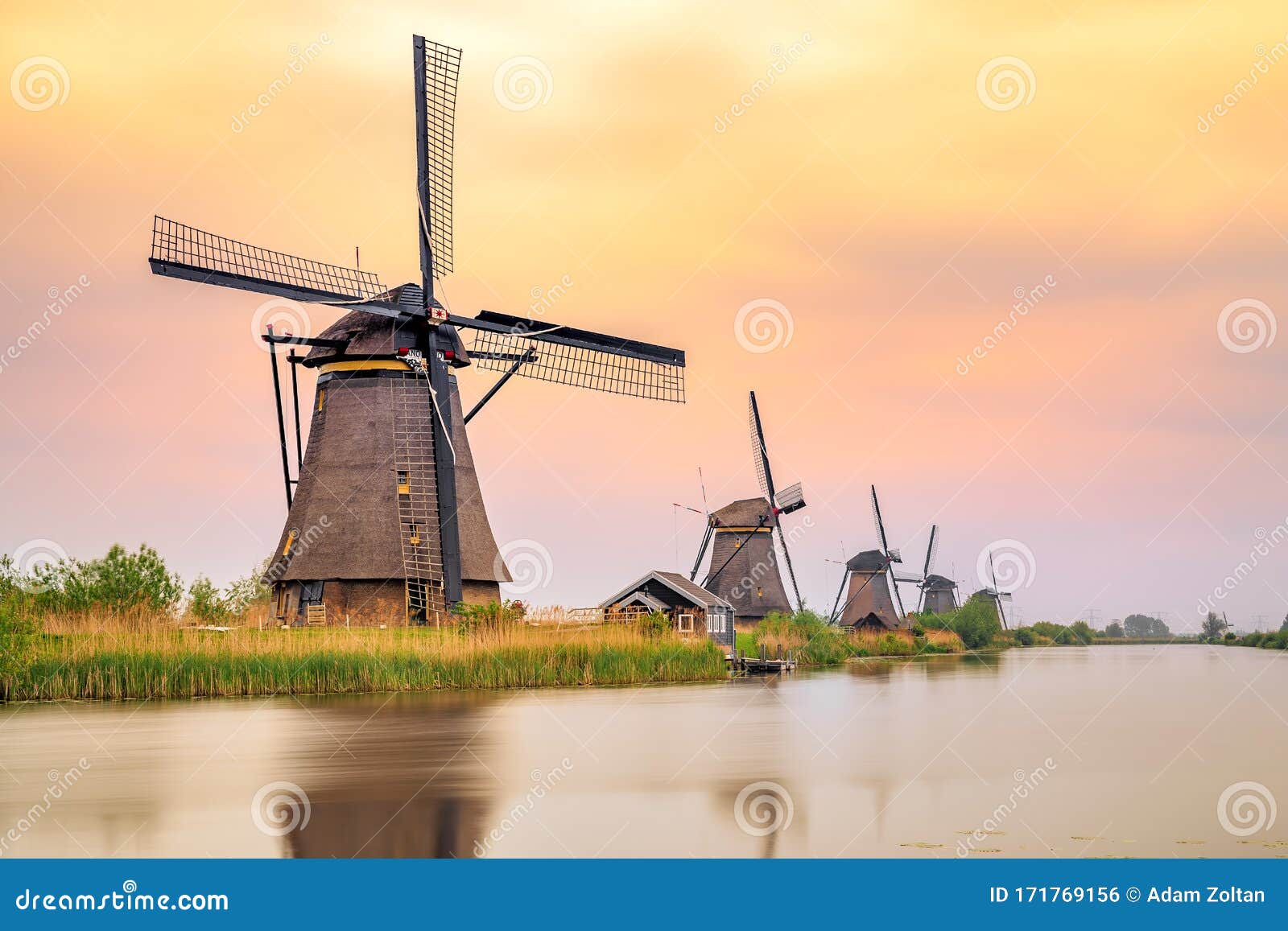 Windmills in Kinderdijk at Sunset, the Netherlands Stock Photo - Image ...