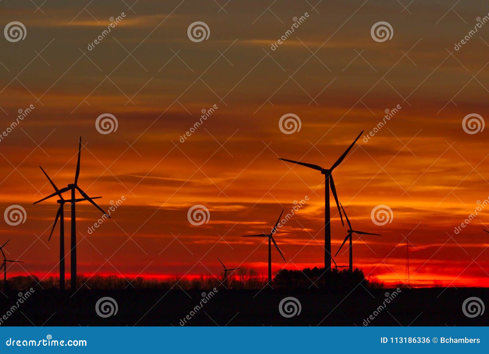 Windmills at sunrise stock photo. Image of sunrise, energy - 113186336
