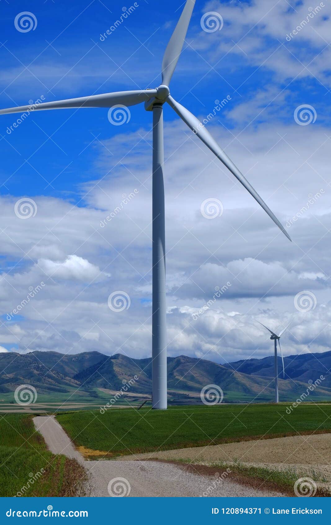 Windmill Producing Electricity with Blue Sky and Clouds Stock Image ...