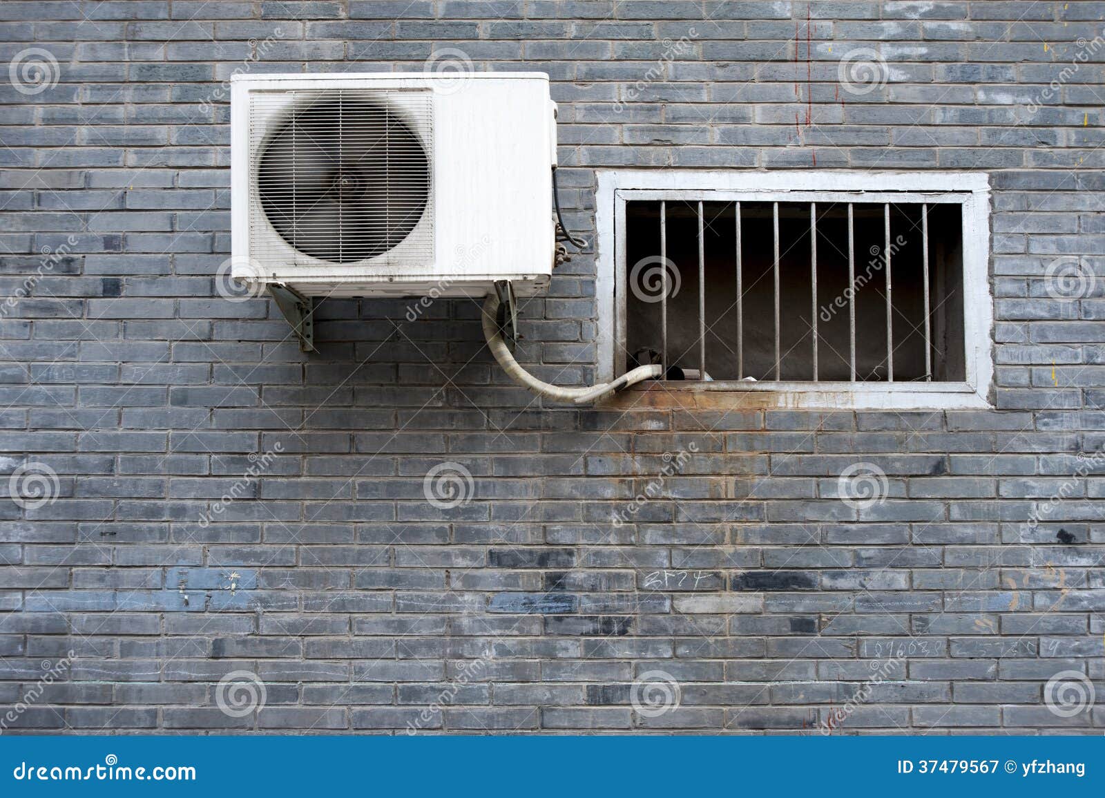 A Window and a Air Conditioner on the Grey Brick Wall Background ...