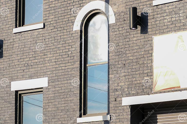Window with Arched Lintel Reflecting the Sky Stock Image - Image of ...