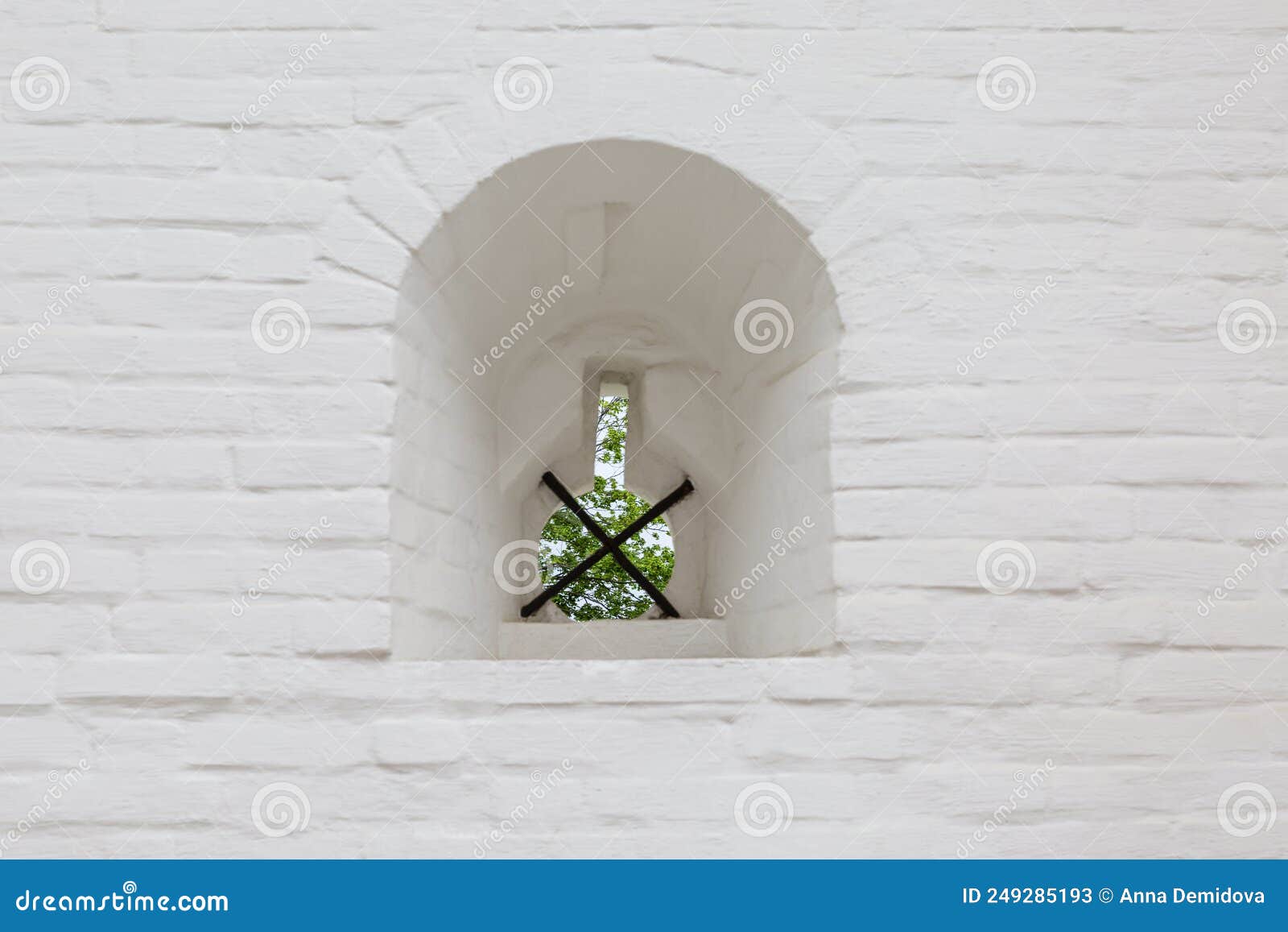 Window with Bars in a White Brick Wall. Overview of the Blooming Garden ...