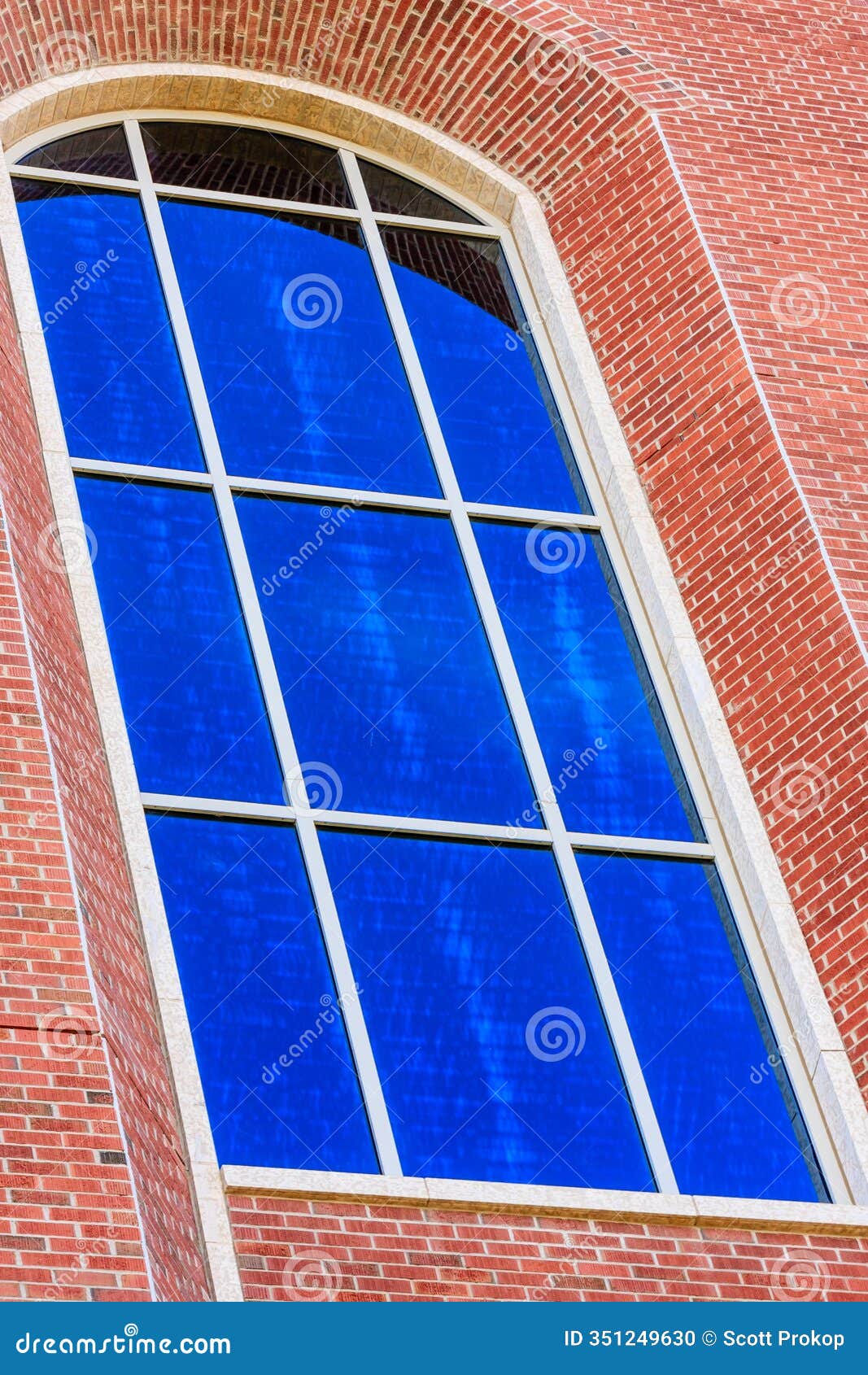 A Window with Blue Glass on a Brick Building Stock Photo - Image of ...