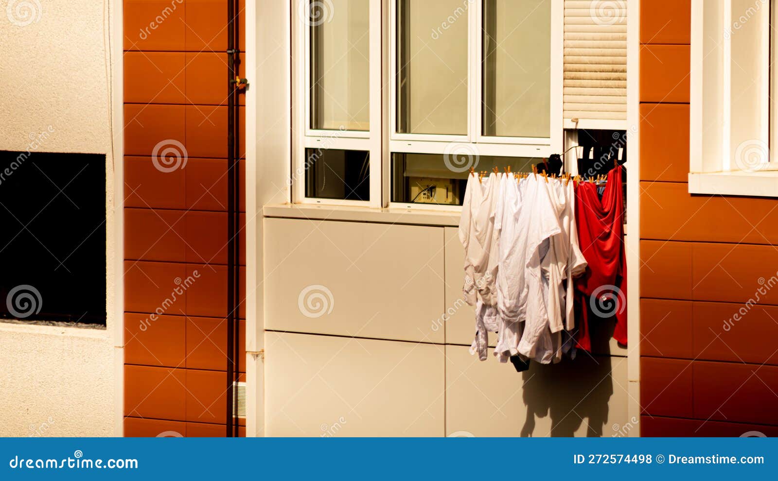 Window in a Building with Laundry (red and White Shirts) Stock Photo ...
