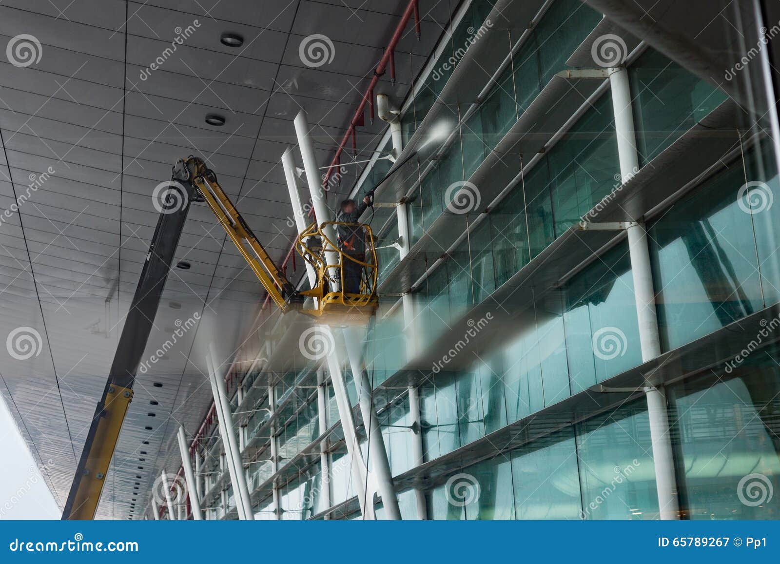 Window Cleaner at Airport Hall, Standing on a Crane Stock Image - Image ...