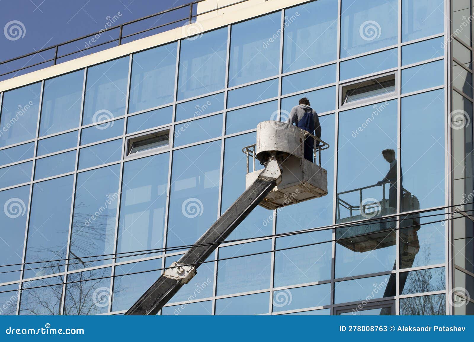 Window Cleaner on a High-rise Building. Window Washing with the Help of ...
