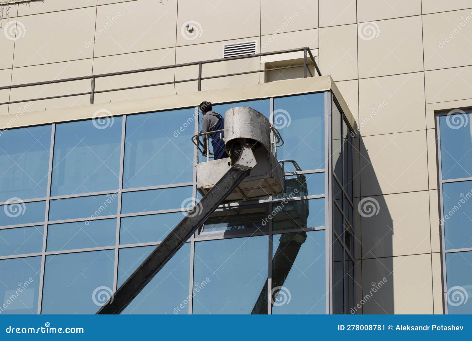 Window Cleaner on a High-rise Building. Window Washing with the Help of ...