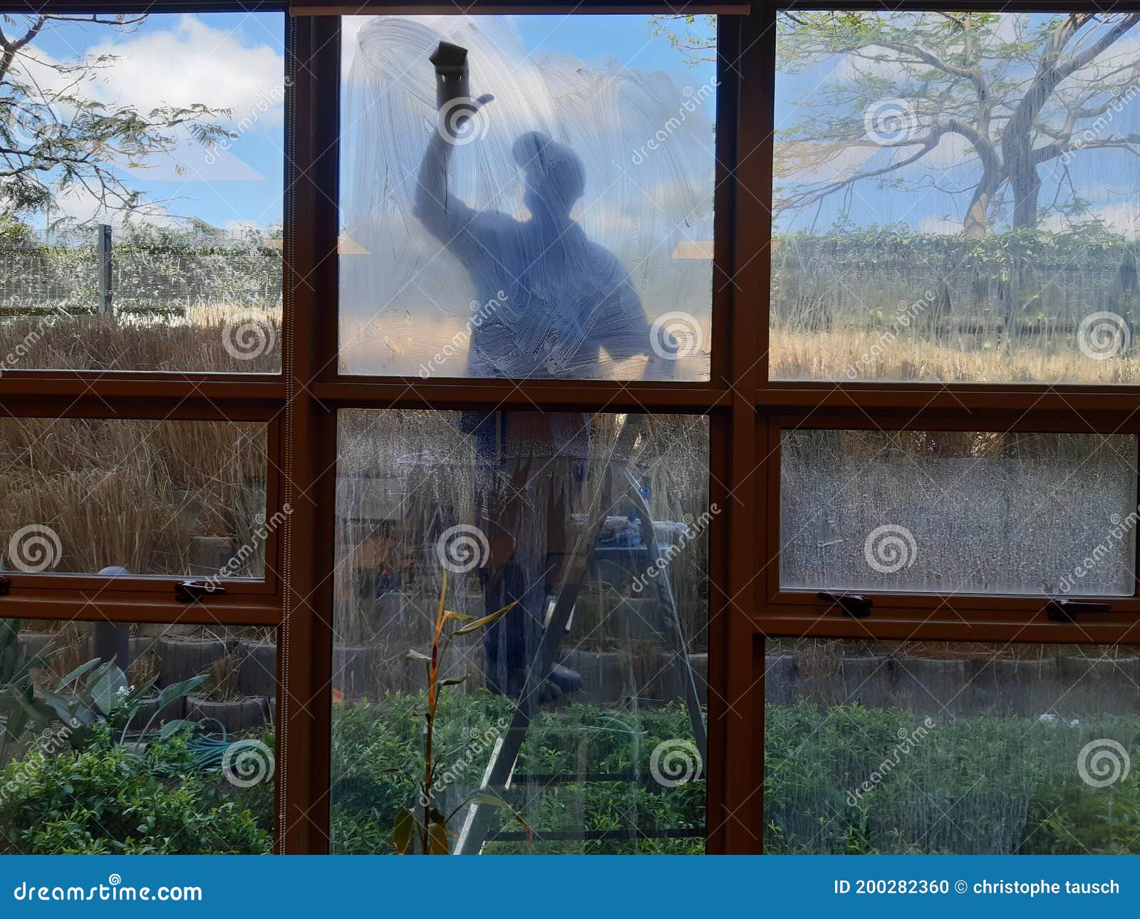 Window Cleaner Silhouette In Action On A Dirty Facade. Editorial Image ...