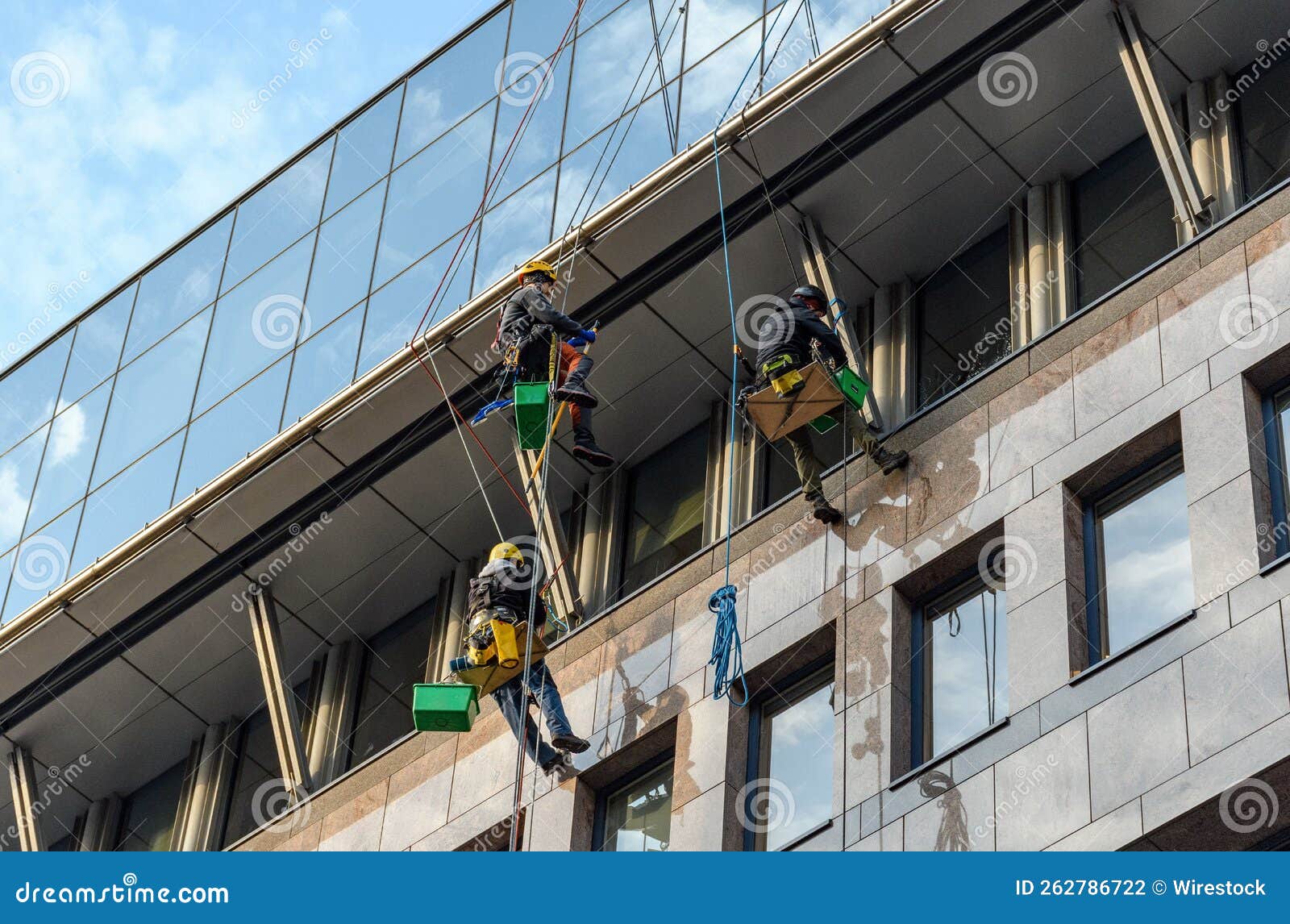 Window Cleaners Wash The Glass Facade On The Same Level. Industrial ...